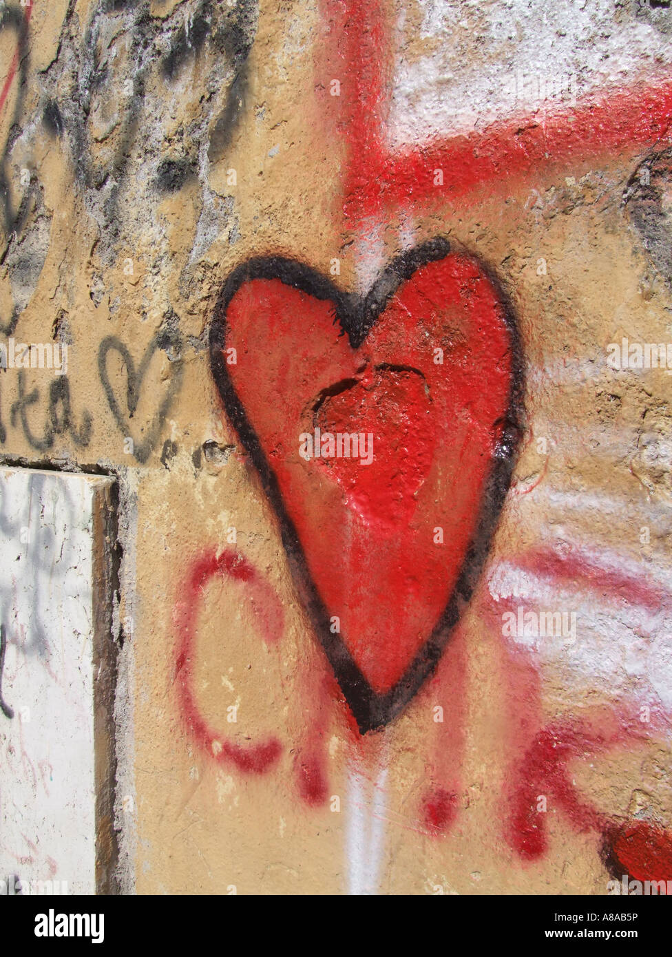 red heart painted on wall Stock Photo - Alamy