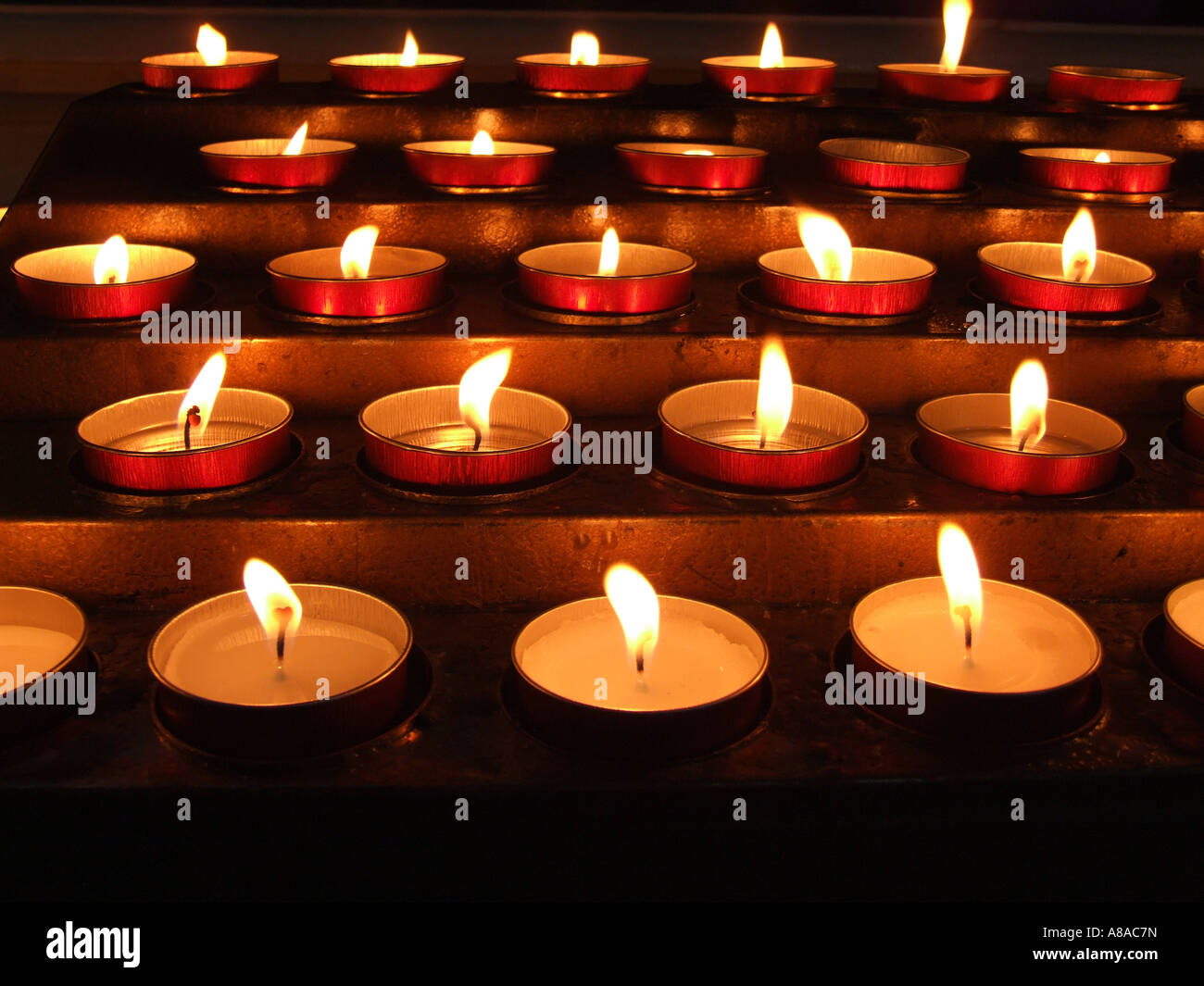 lit candles in church Stock Photo - Alamy