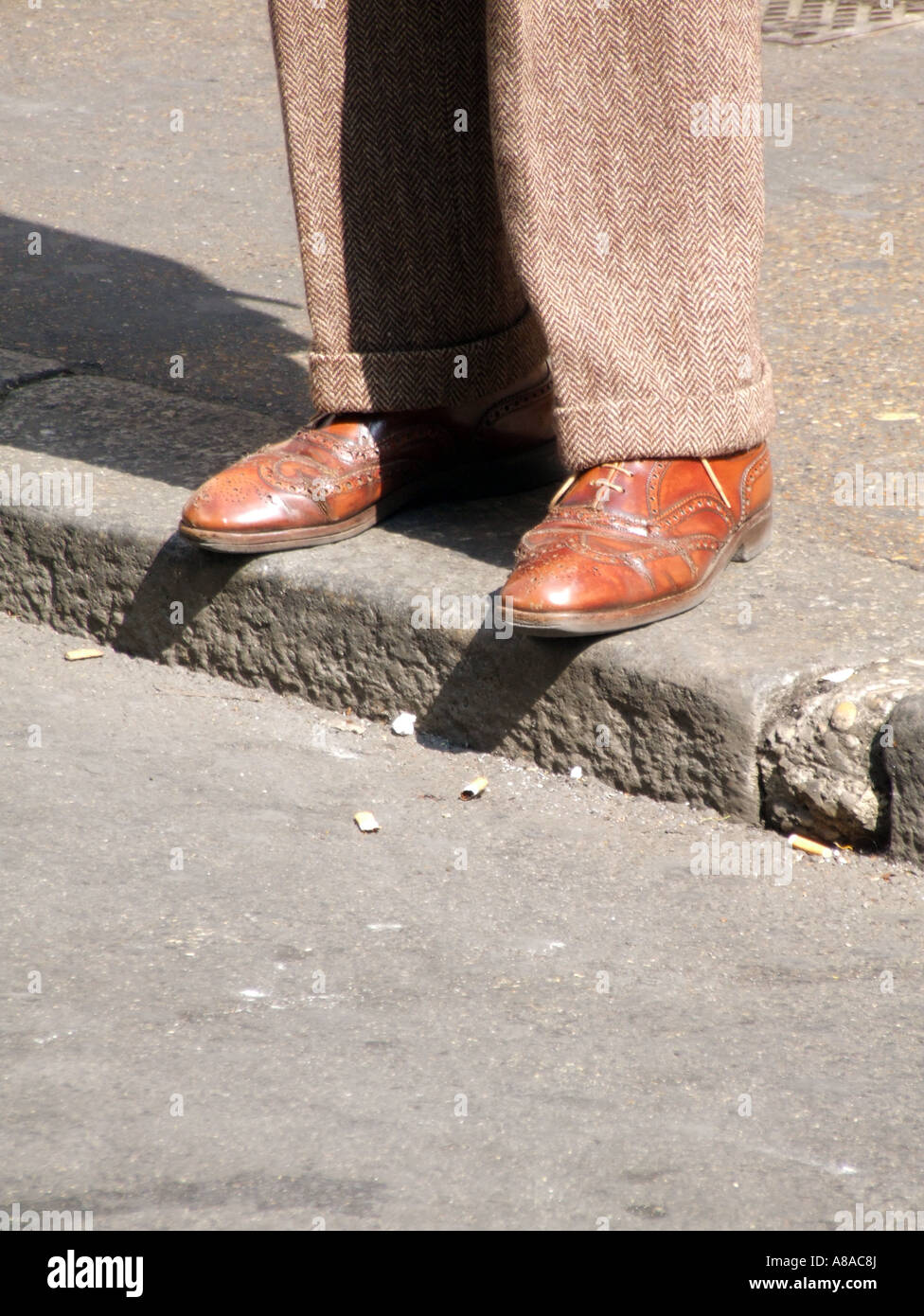man standing on pavement Stock Photo - Alamy