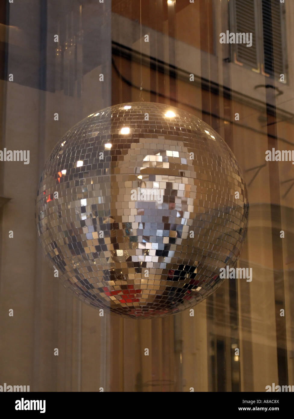 hanging mirror ball sphere in shop window Stock Photo - Alamy