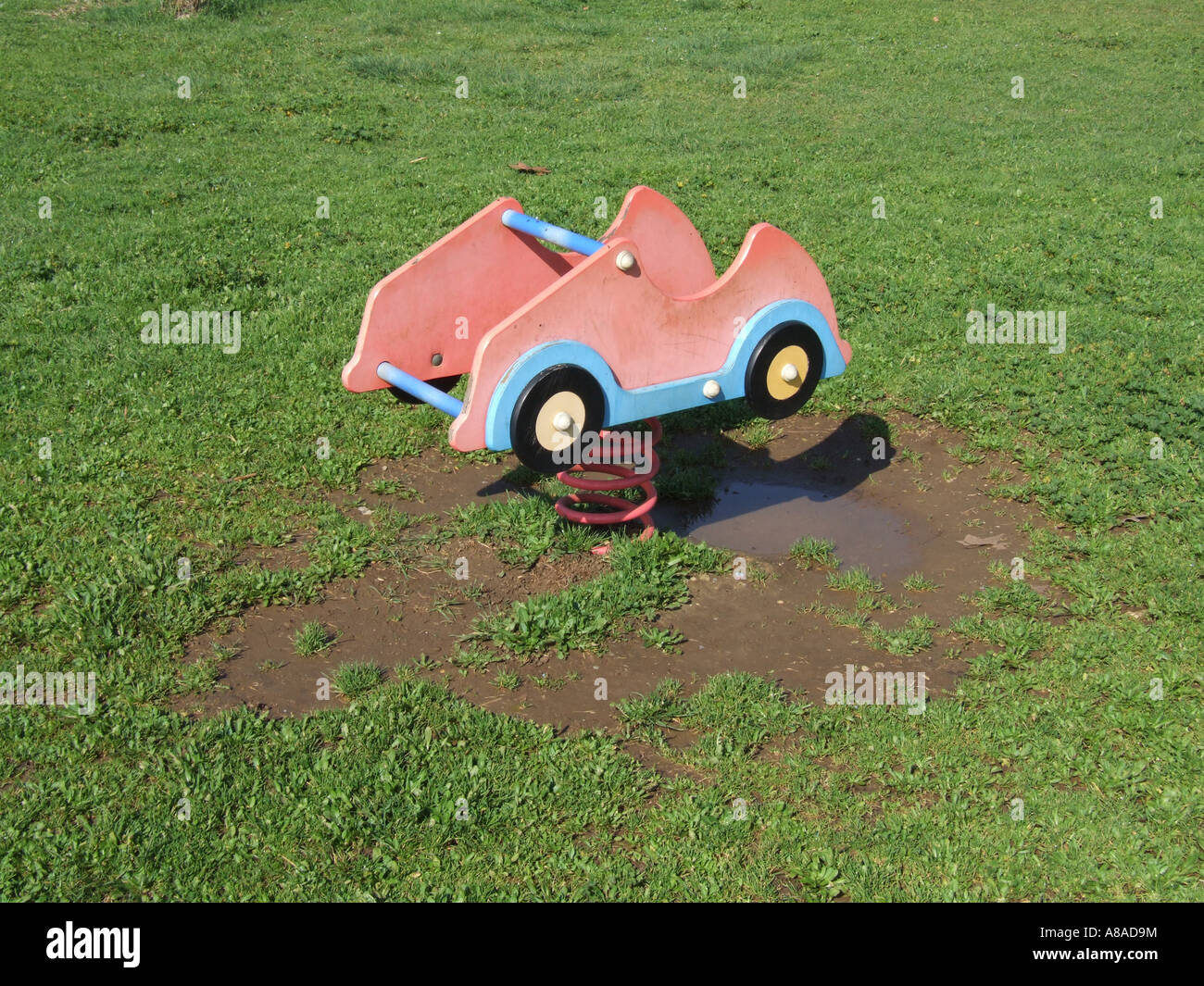 red playground toy car ride Stock Photo - Alamy