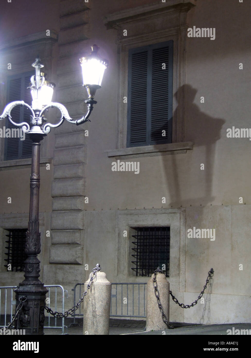 Lamp Post Shadow On Street Road In Rome High Resolution Stock ...
