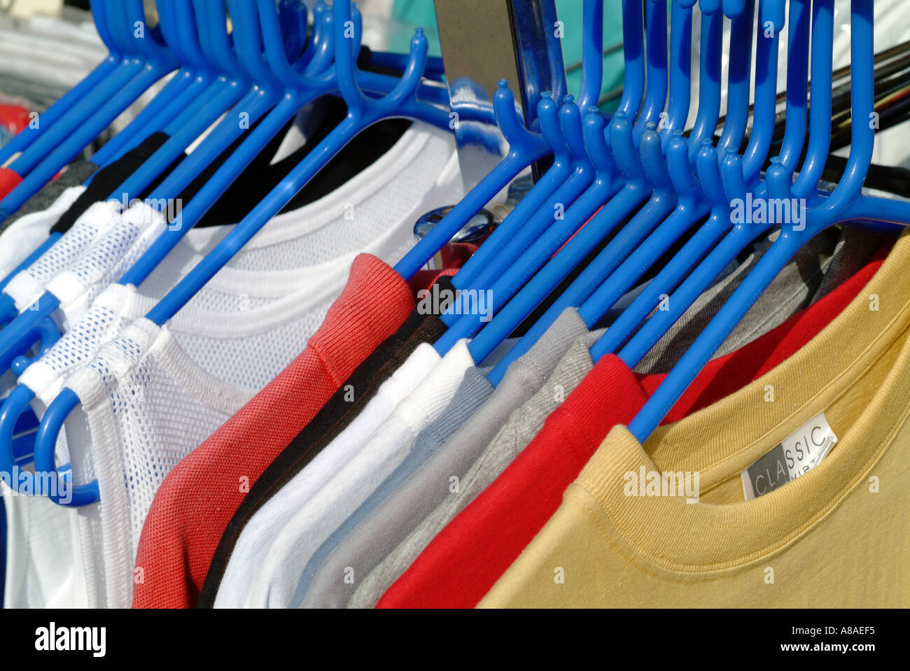clothes on hangers textiles, industry, cloth Stock Photo - Alamy
