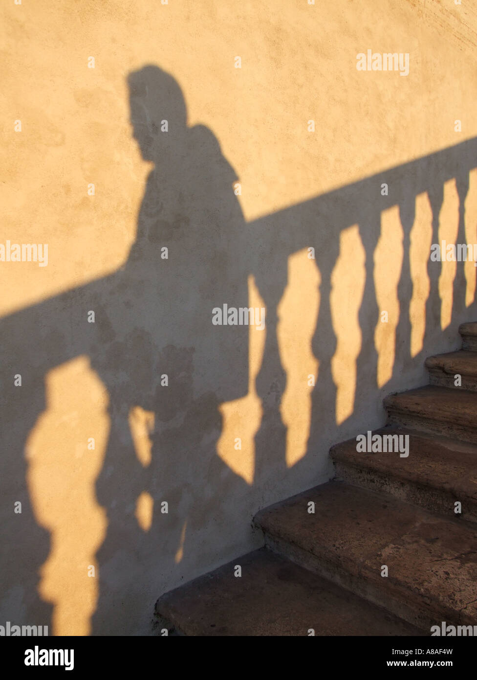 man shadow on wall Stock Photo - Alamy