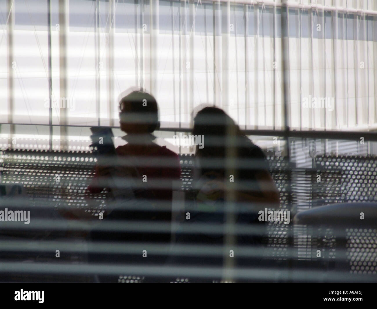 reflection of a couple in window Stock Photo - Alamy