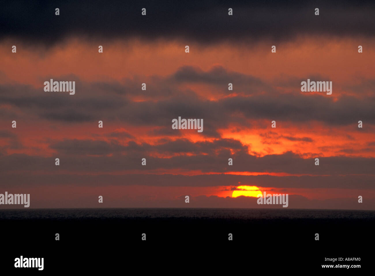 Golden sunset through layers of stratus marine layer clouds at over the ...