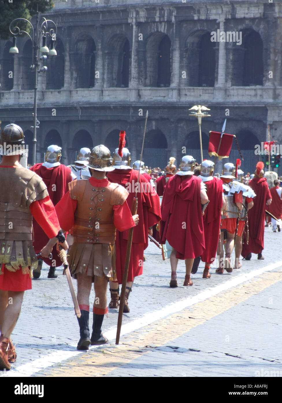 Roman soldiers in a procession by the colosseum celebrating the birth ...