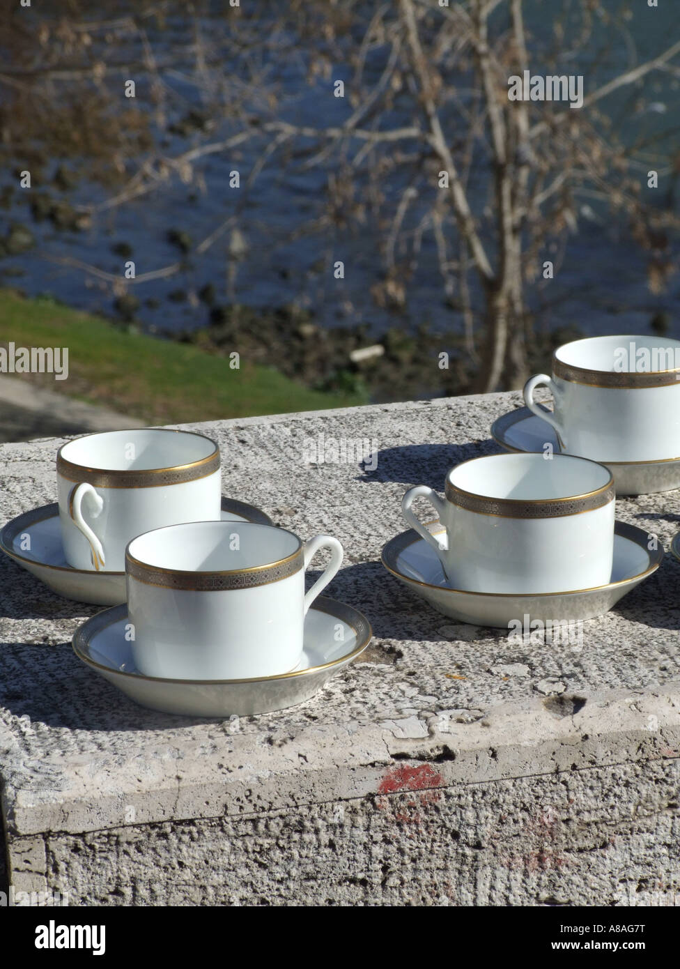 cups and saucers outdoors Stock Photo - Alamy