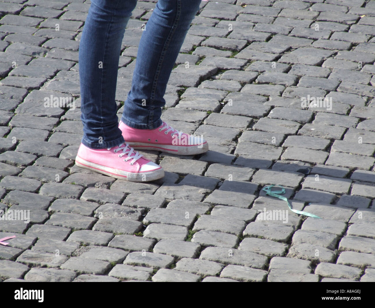 one person walking in street in city town Stock Photo - Alamy