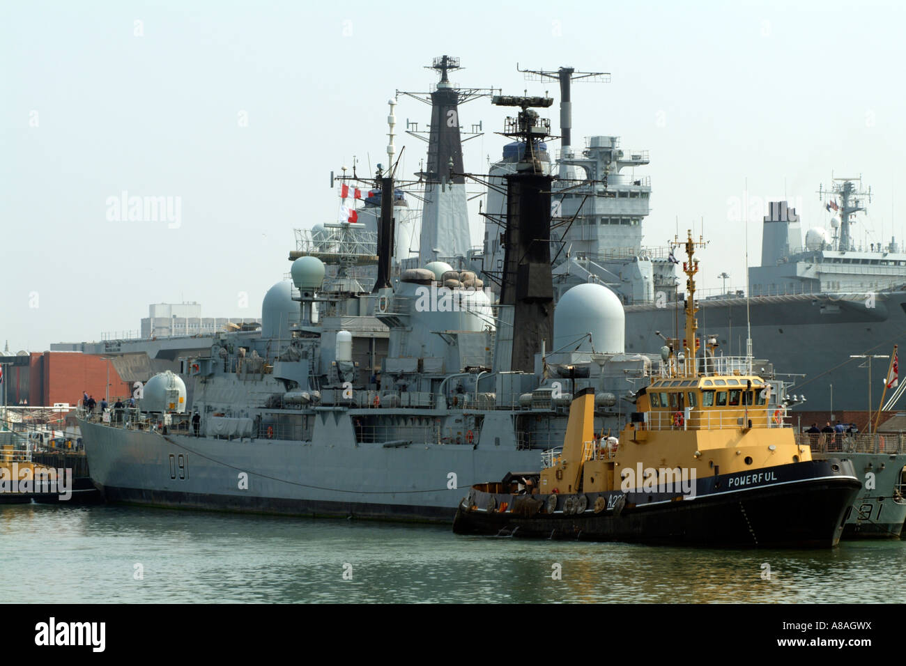 SERCO Denholm operated vessel Tug Powerful underway and the Royal Navy ...