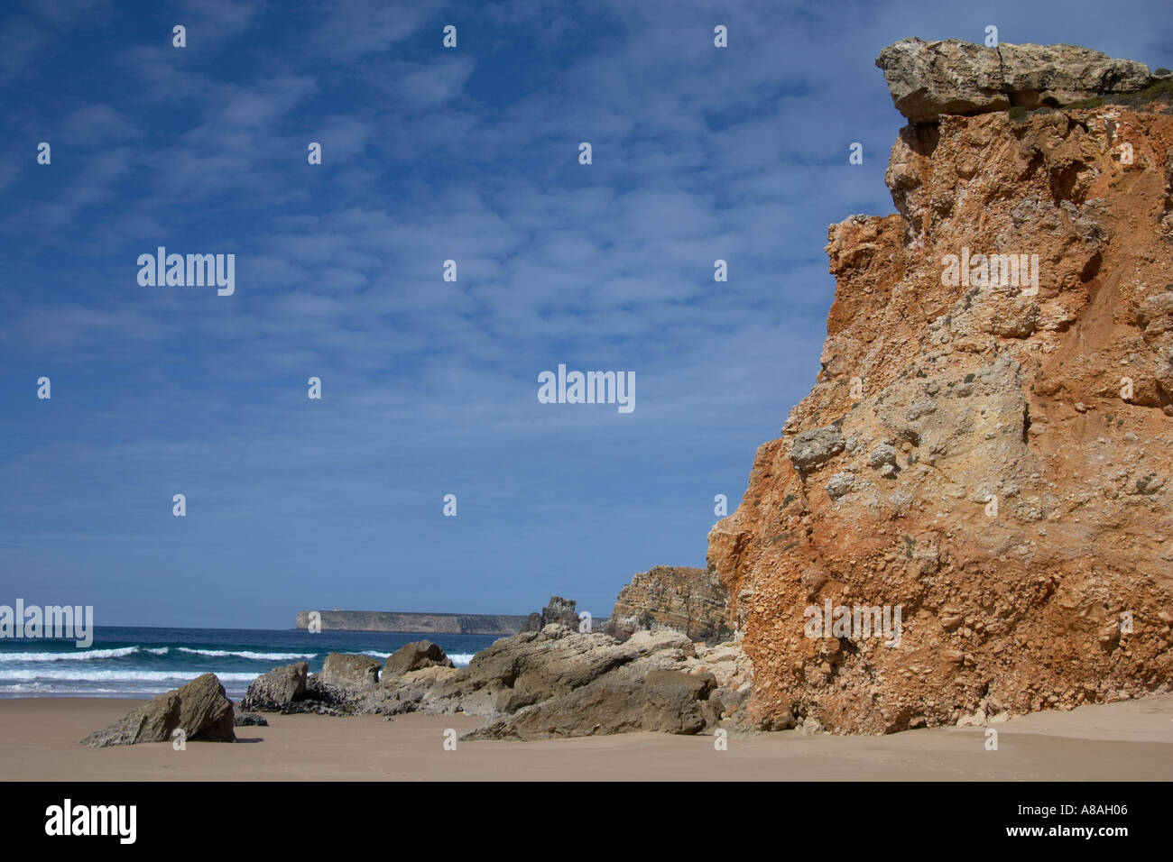 Honeycombe feature. Burnt orange sandstone cliff, nice cloud formation ...
