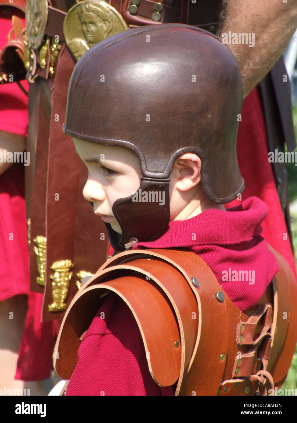boy dressed as roman soldier in a procession by the colosseum ...
