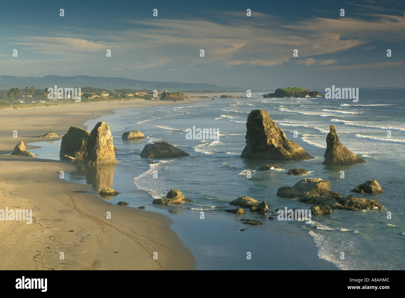 Overlooking coastal rock sea stacks ocean waves and sand beach Bandon ...