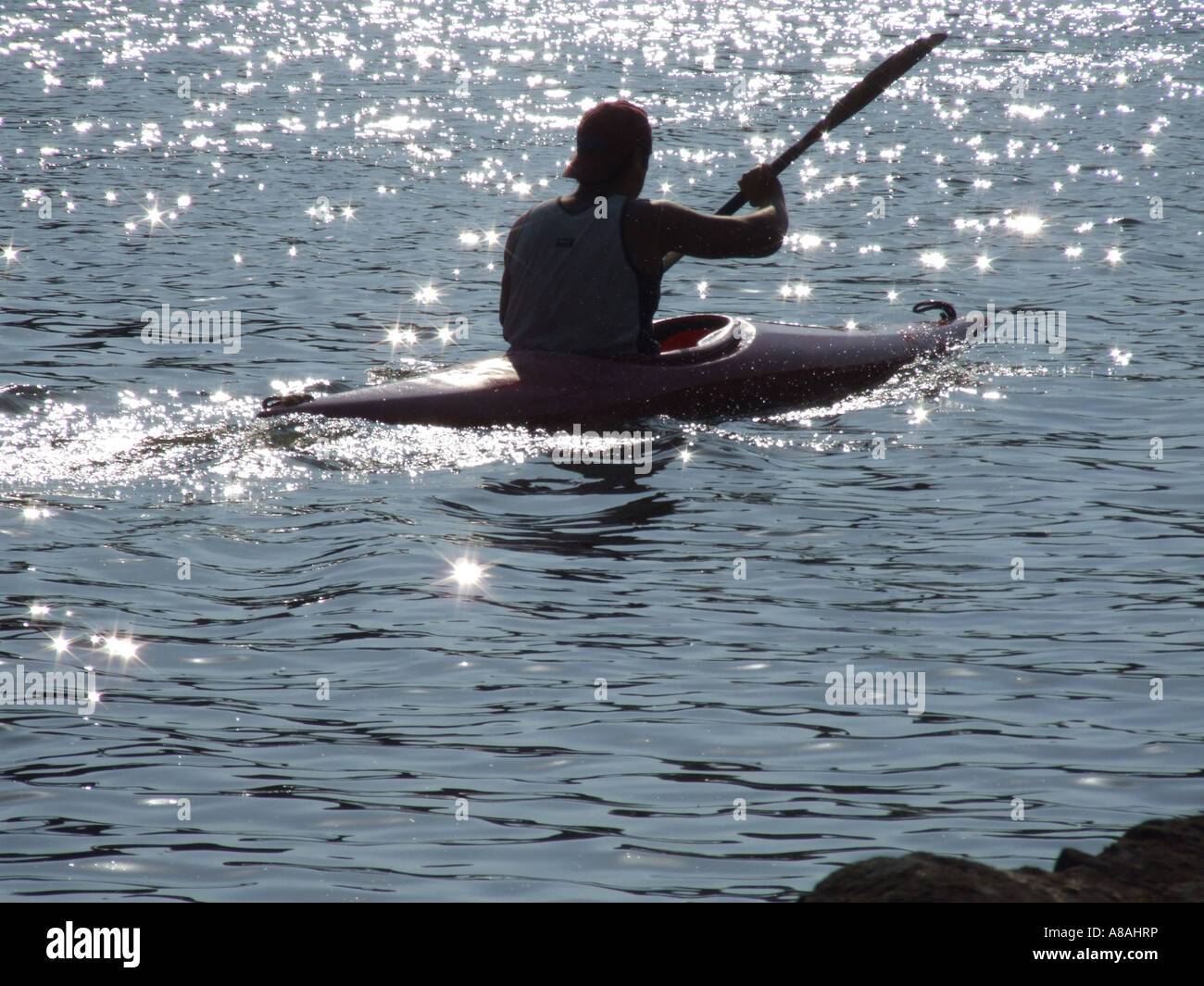 man rowing canoe Stock Photo - Alamy