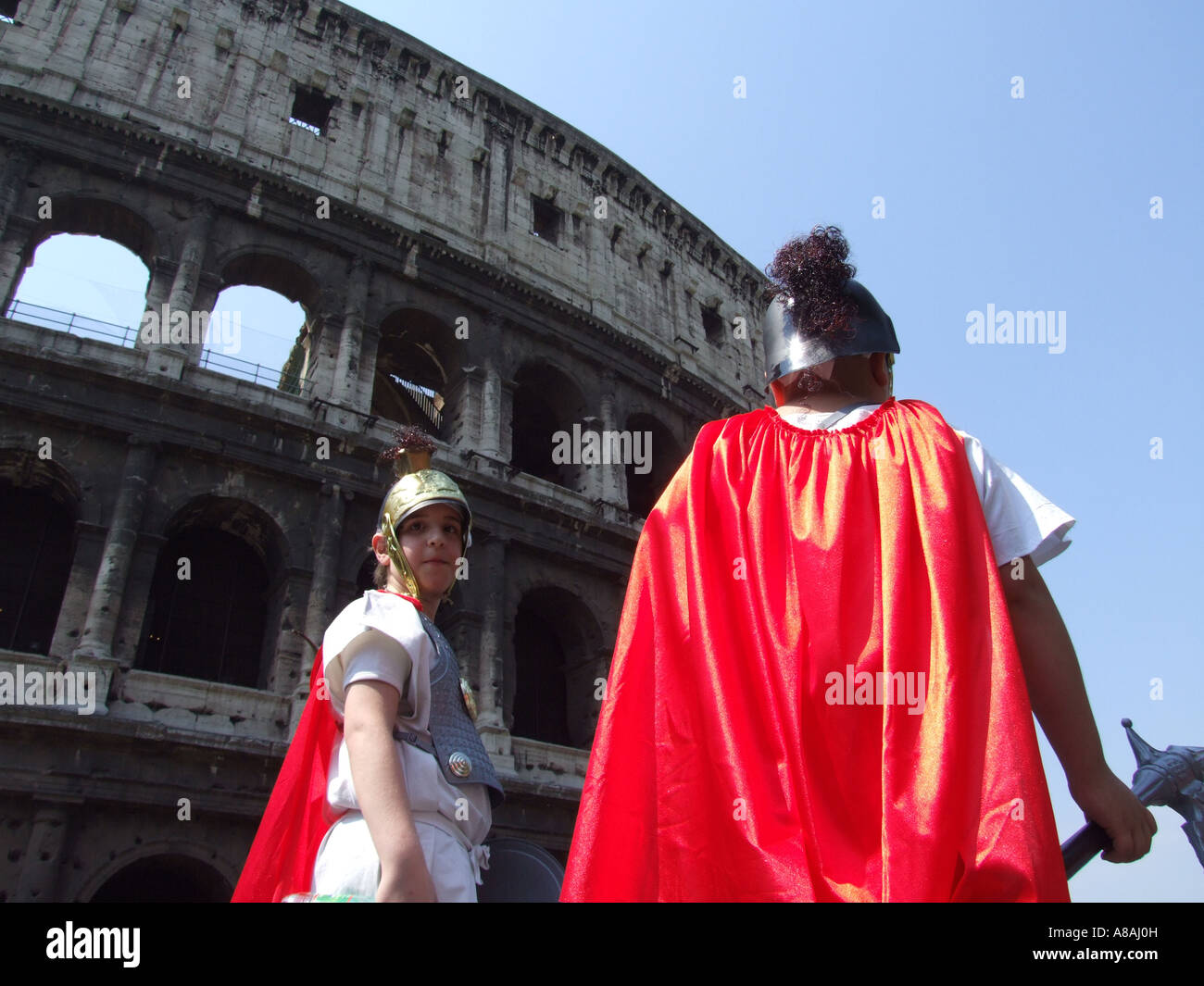 boys dressed as roman soldiers in a procession by the colosseum ...