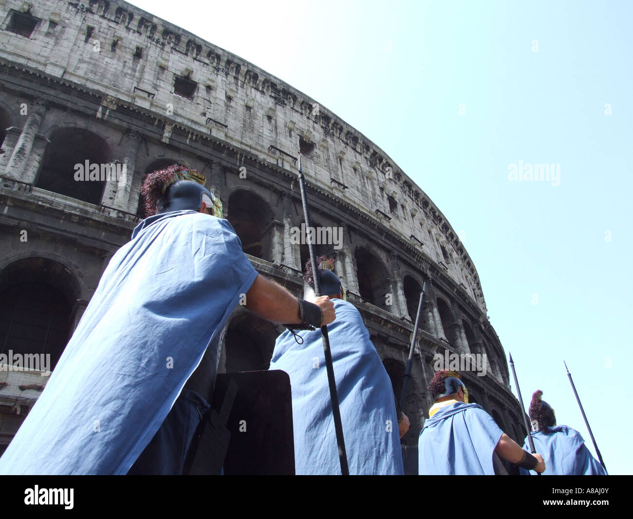 Roman soldiers in a procession by the colosseum celebrating the birth ...