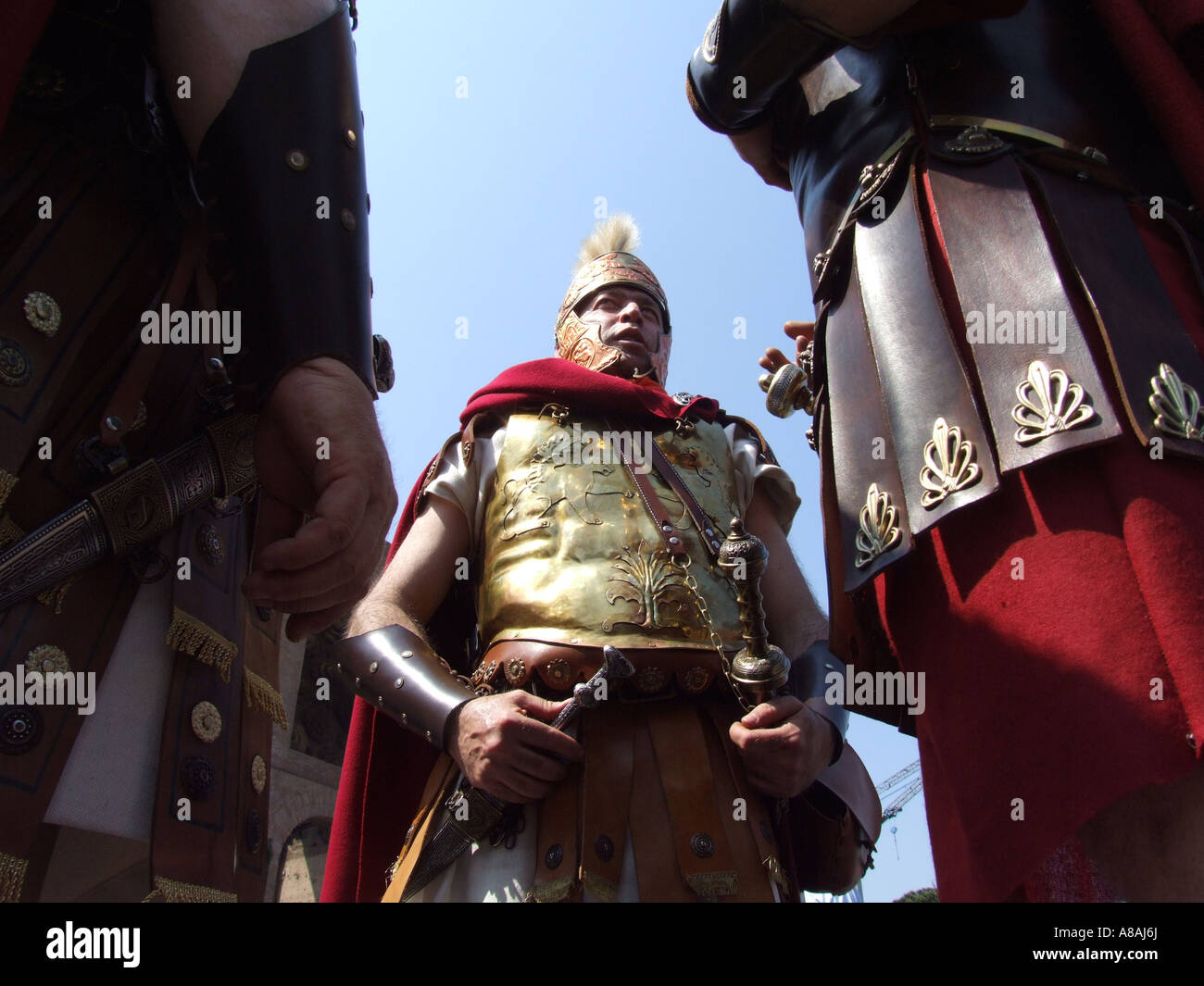 three roman soldiers in a procession celebrating the birth of Rome ...