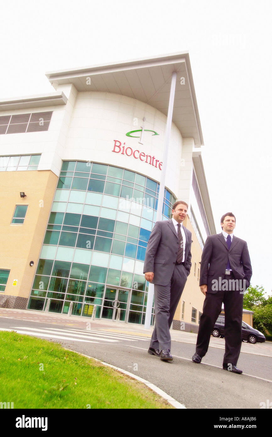 Two Caucasian businessmen in suits outside the Biocentre at York ...