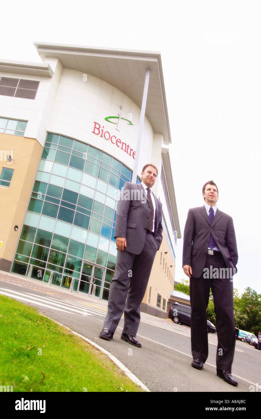 Two Caucasian businessmen in suits outside the Biocentre at York ...