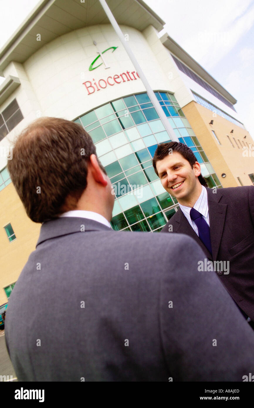 “Two businessmen talking outside the BioCentre at York Science Park ...