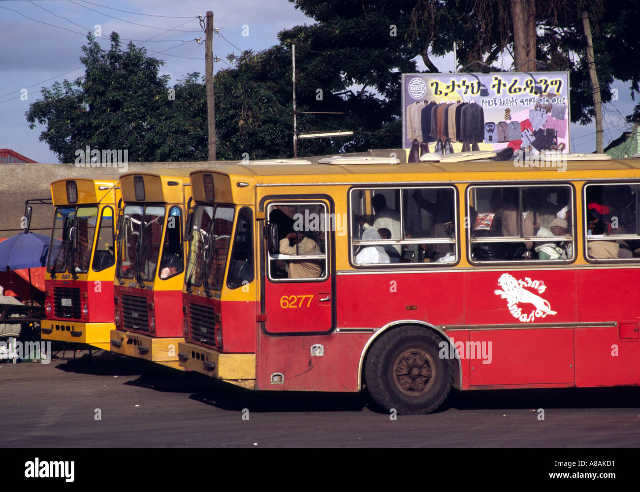 Local city buses wait in line in a busy street, Addis Ababa, Ethiopia ...