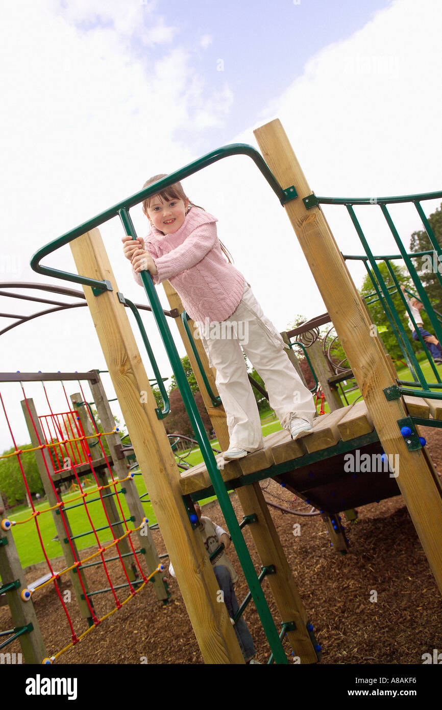 Young girl playing on climbing frame at Rowntree Park York UK Stock ...