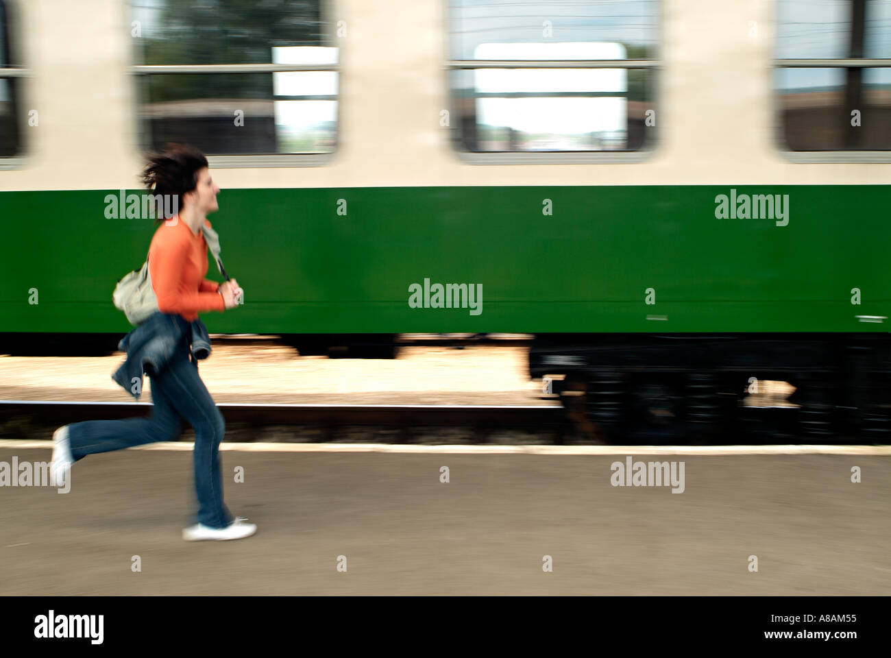 Woman Running Along a Train Station Platform Trying to Catch a Stock ... Woman Running Along a Train Station Platform Trying to Catch a Stock ...