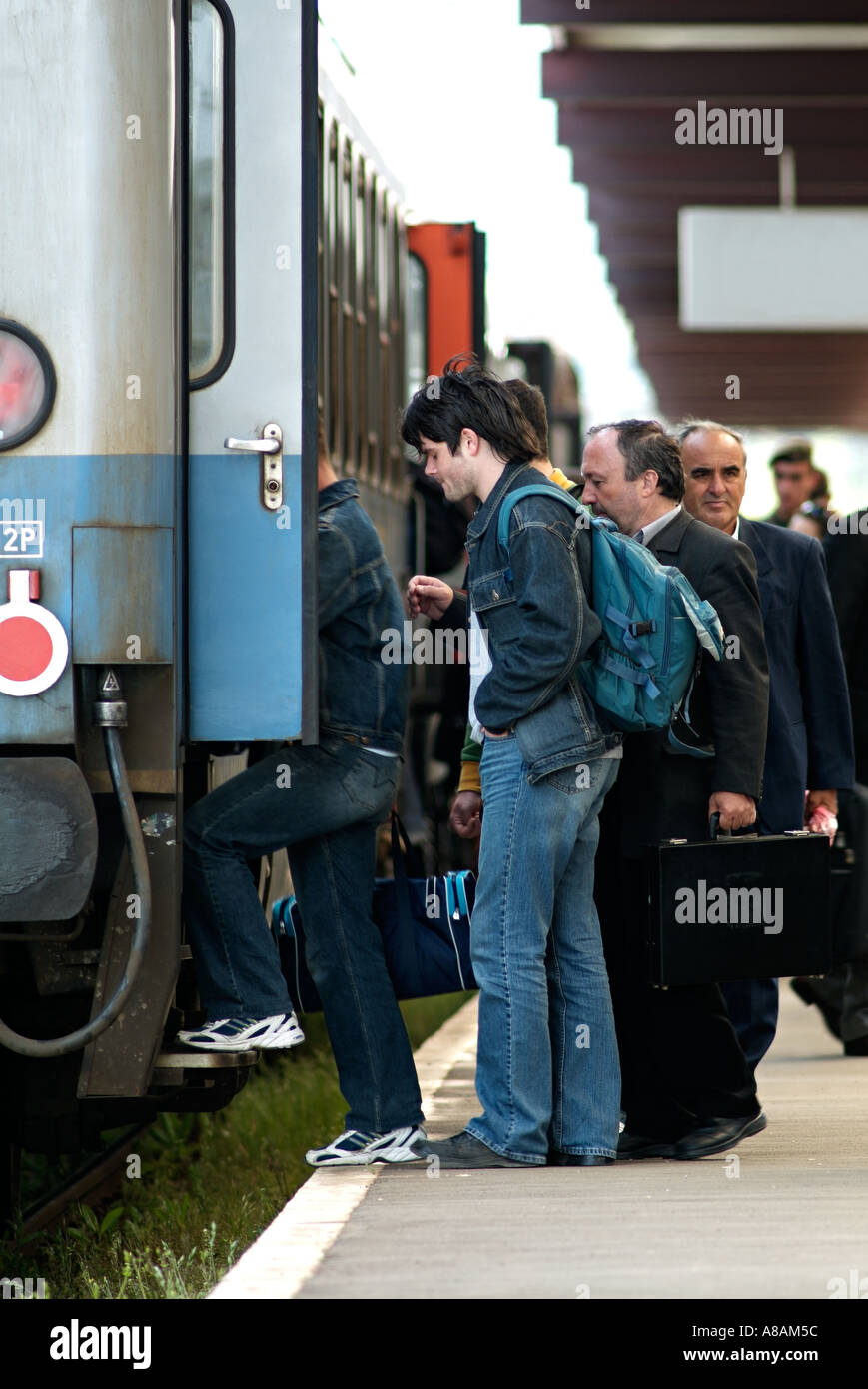 Passengers Boarding a Train Carriage Stock Photo - Alamy