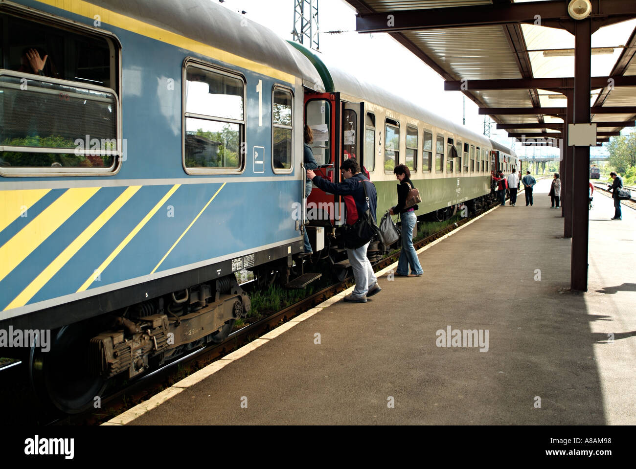 Passengers Boarding a Train Carriage at a Railway Station Stock Photo ...
