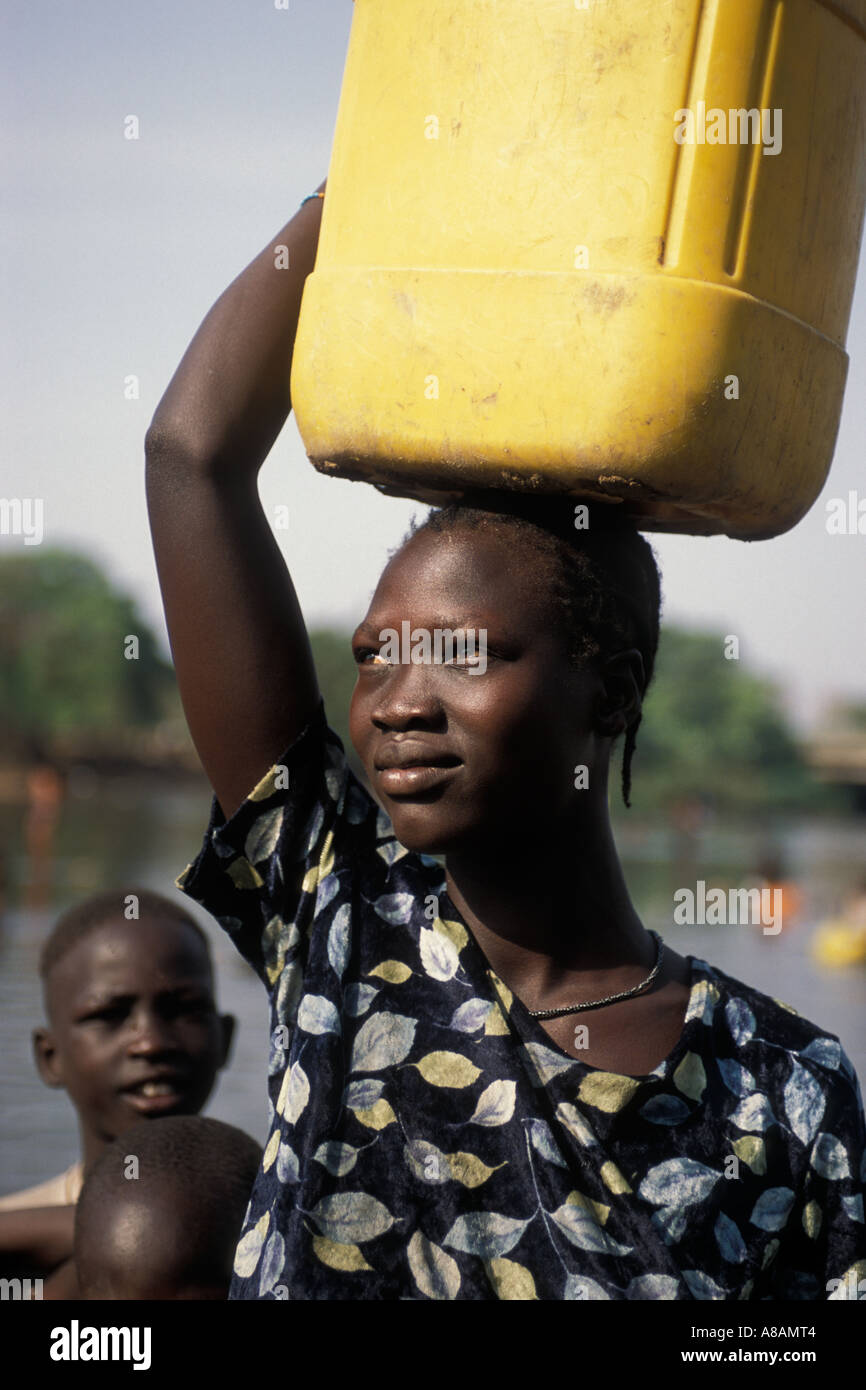 Woman collecting water from the Baro river , Gambella , Ethiopia Stock ...