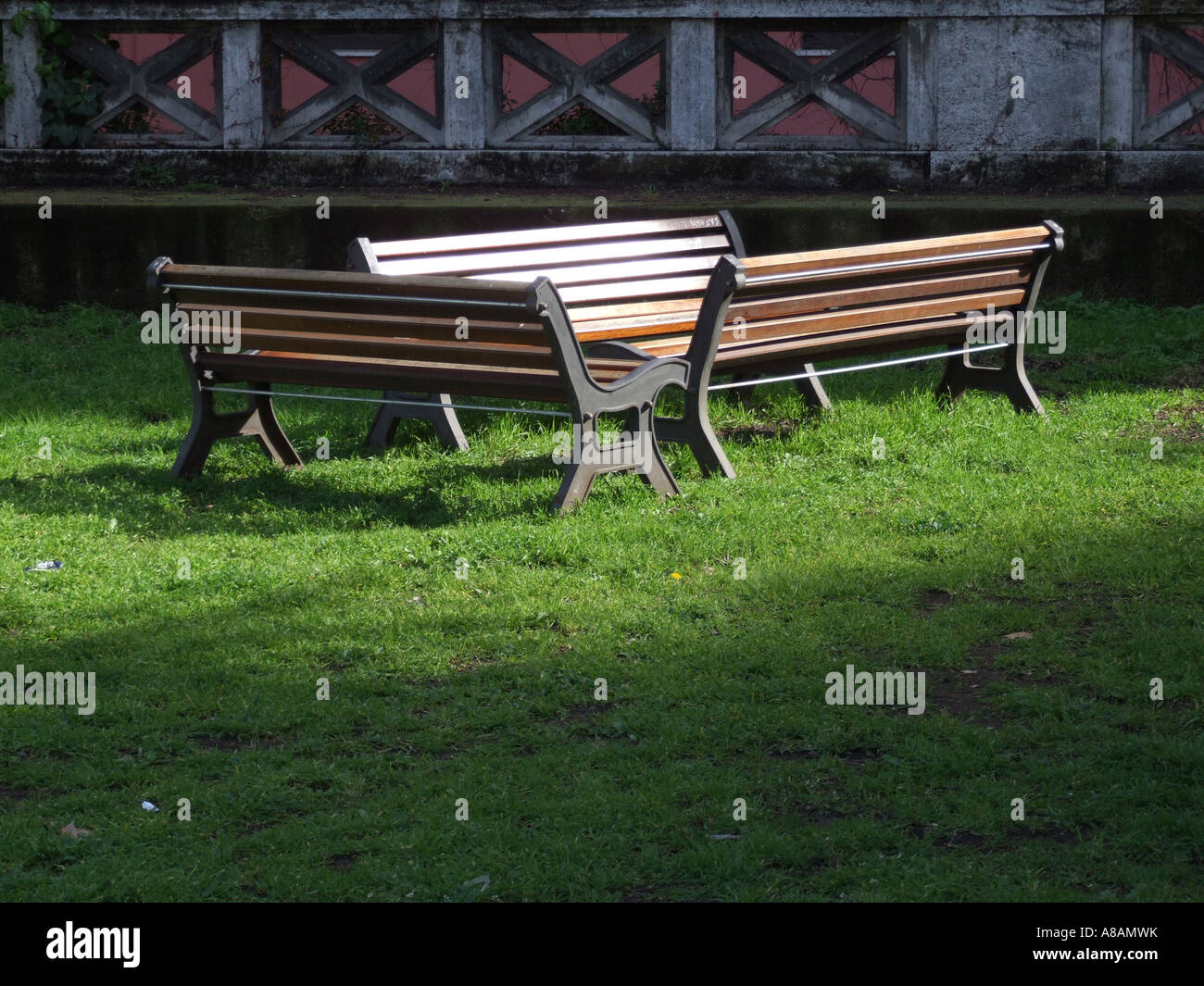 three benches in park Stock Photo - Alamy