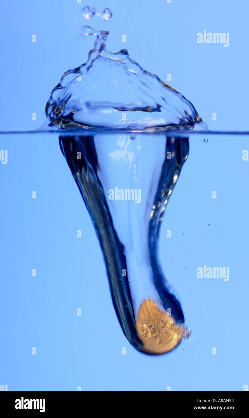 one pound coin down the drain Stock Photo - Alamy