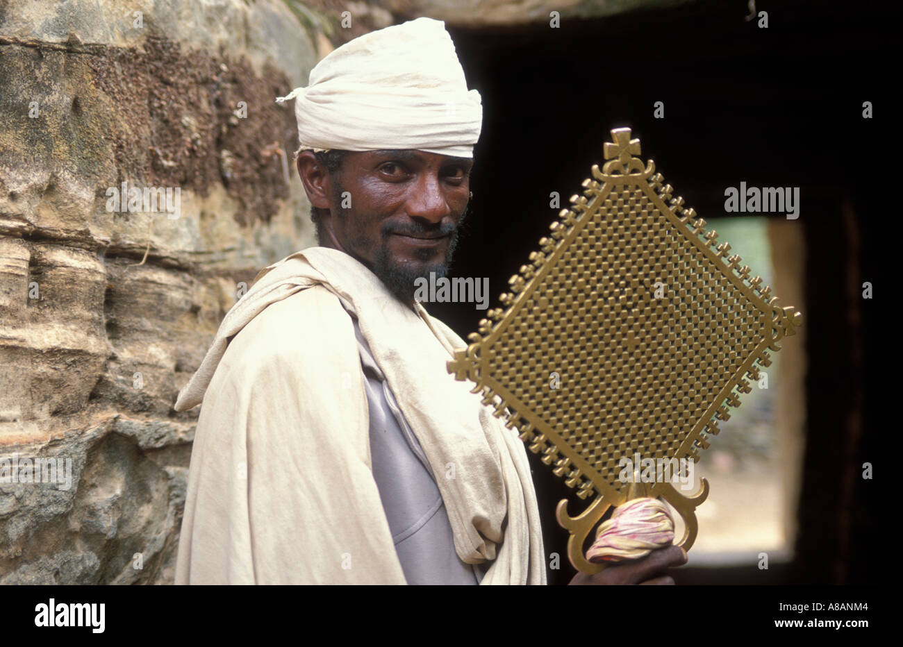 Priest with a gold plated diamond cross in Gebriel Wukien rock-hewn ...