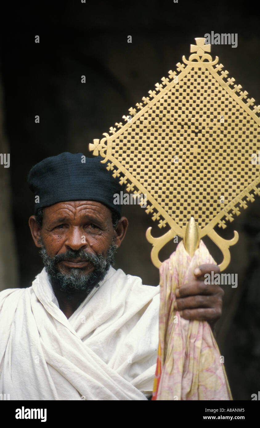 Priest with a gold plated diamond cross in Gebriel Wukien rock-hewn ...