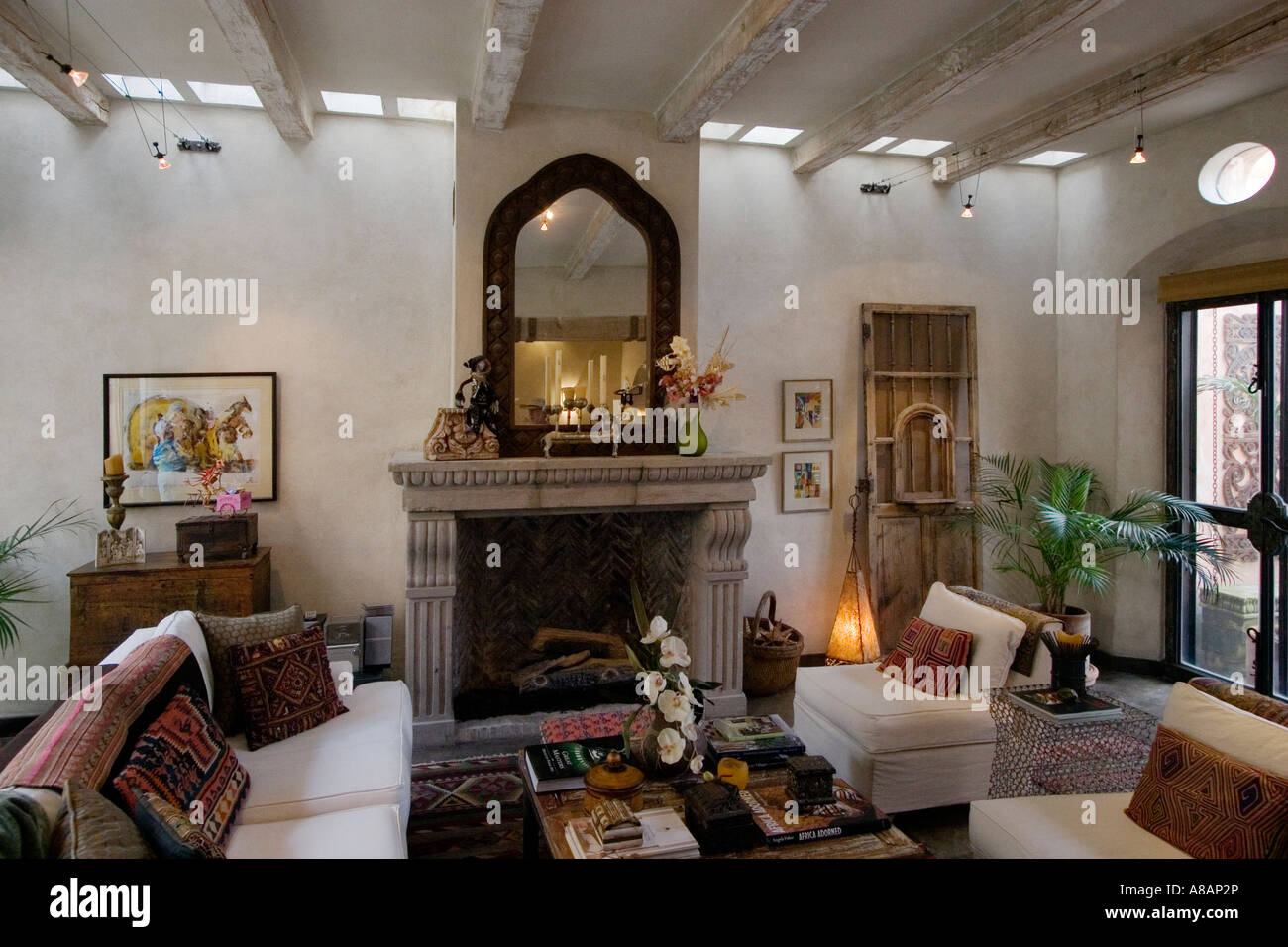 A contemporary LIVING ROOM with a STONE CARVED FIREPLACE visited during ...