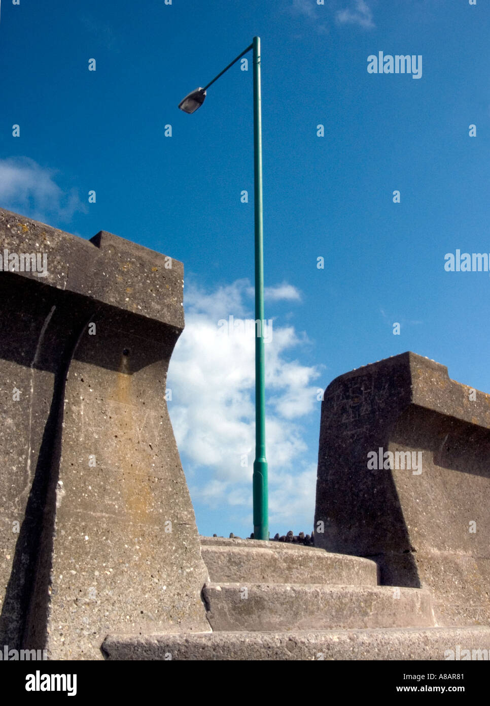 Seawall and lamp post, Isle of Man Stock Photo - Alamy