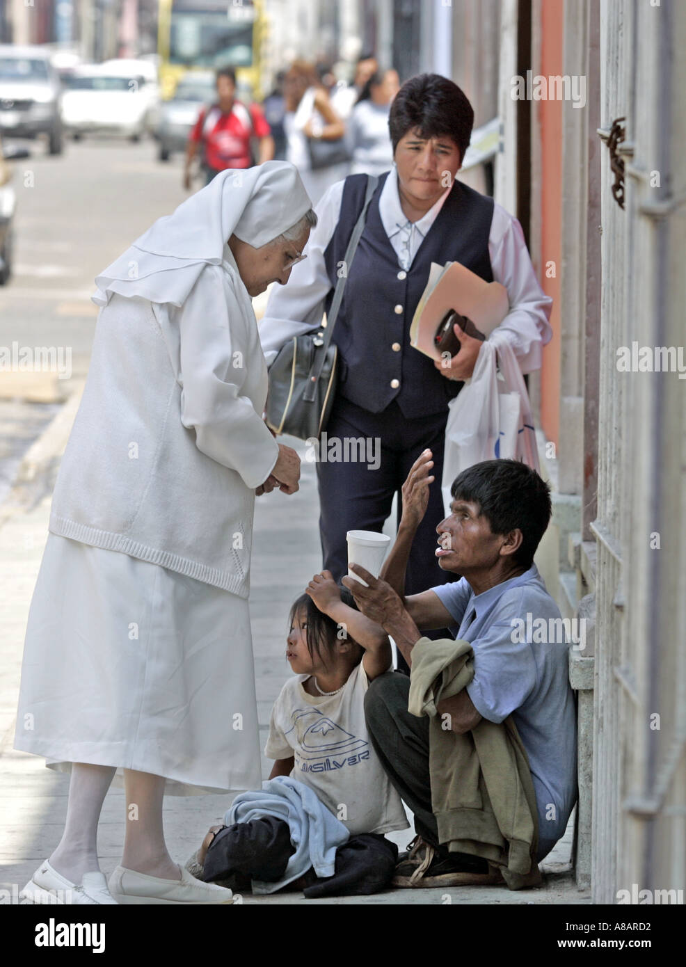 Child giving alms hi-res stock photography and images - Alamy