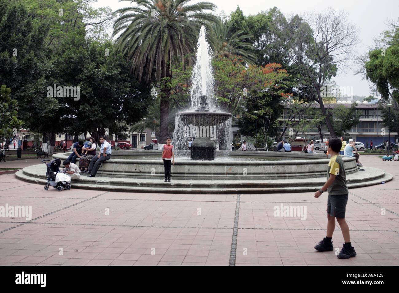 Residents of Oaxaca Mexico and visitors enjoy a Sunday afternoon in ...