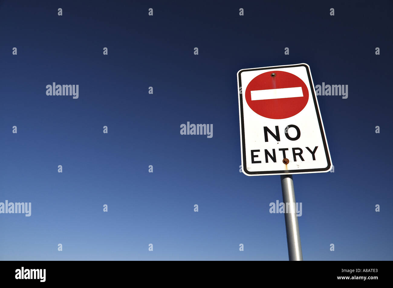 No Entry Signboard against blue sky Stock Photo - Alamy
