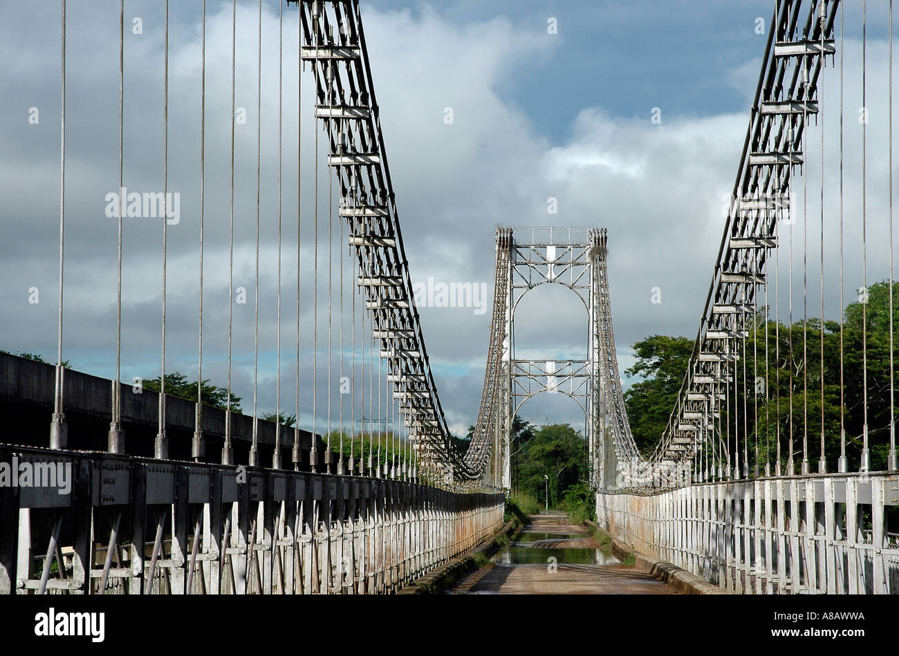 An iron bridge designed by the famous Gustave Eiffel spans the Cuyuní ...