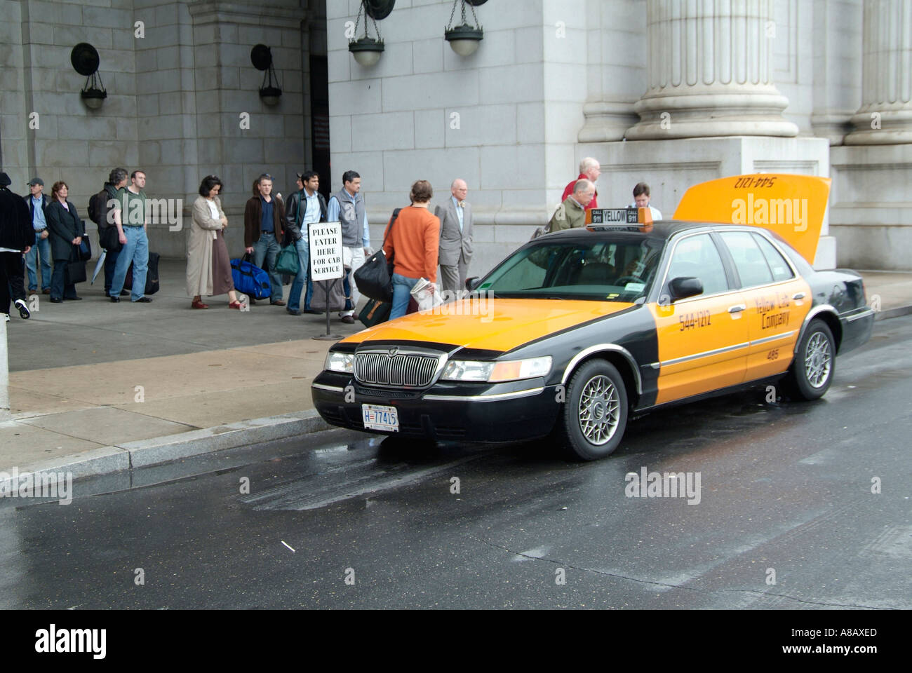 People line up to catch taxi cab at the Union Station in Washington DC ...