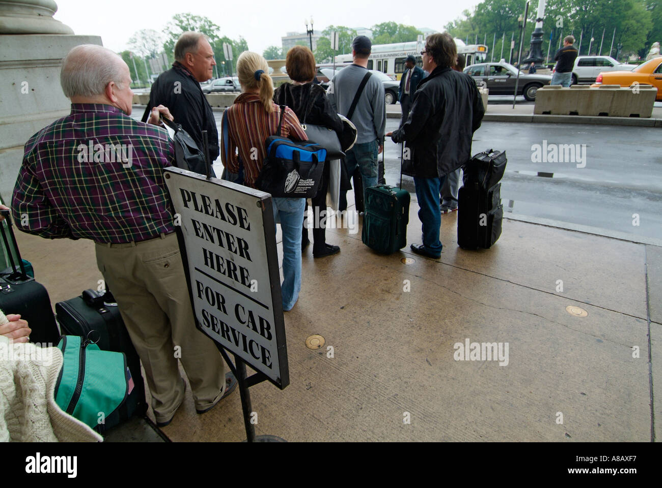 People line up to catch taxi cab at the Union Station in Washington DC ...