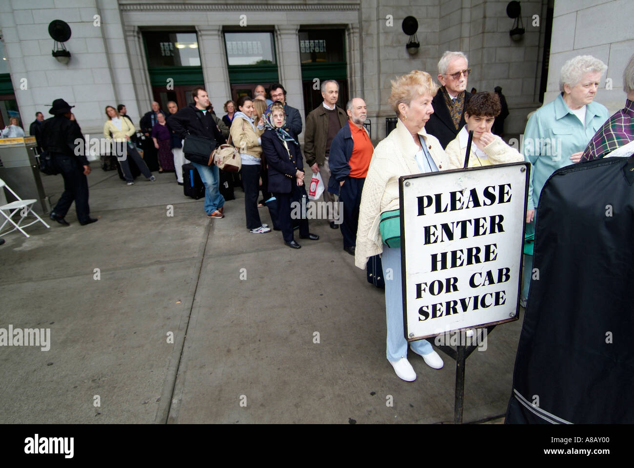 People line up to catch taxi cab at the Union Station in Washington DC ...