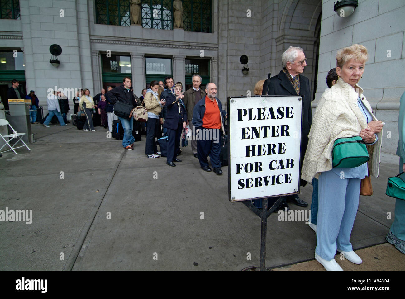 People line up to catch taxi cab at the Union Station in Washington DC ...