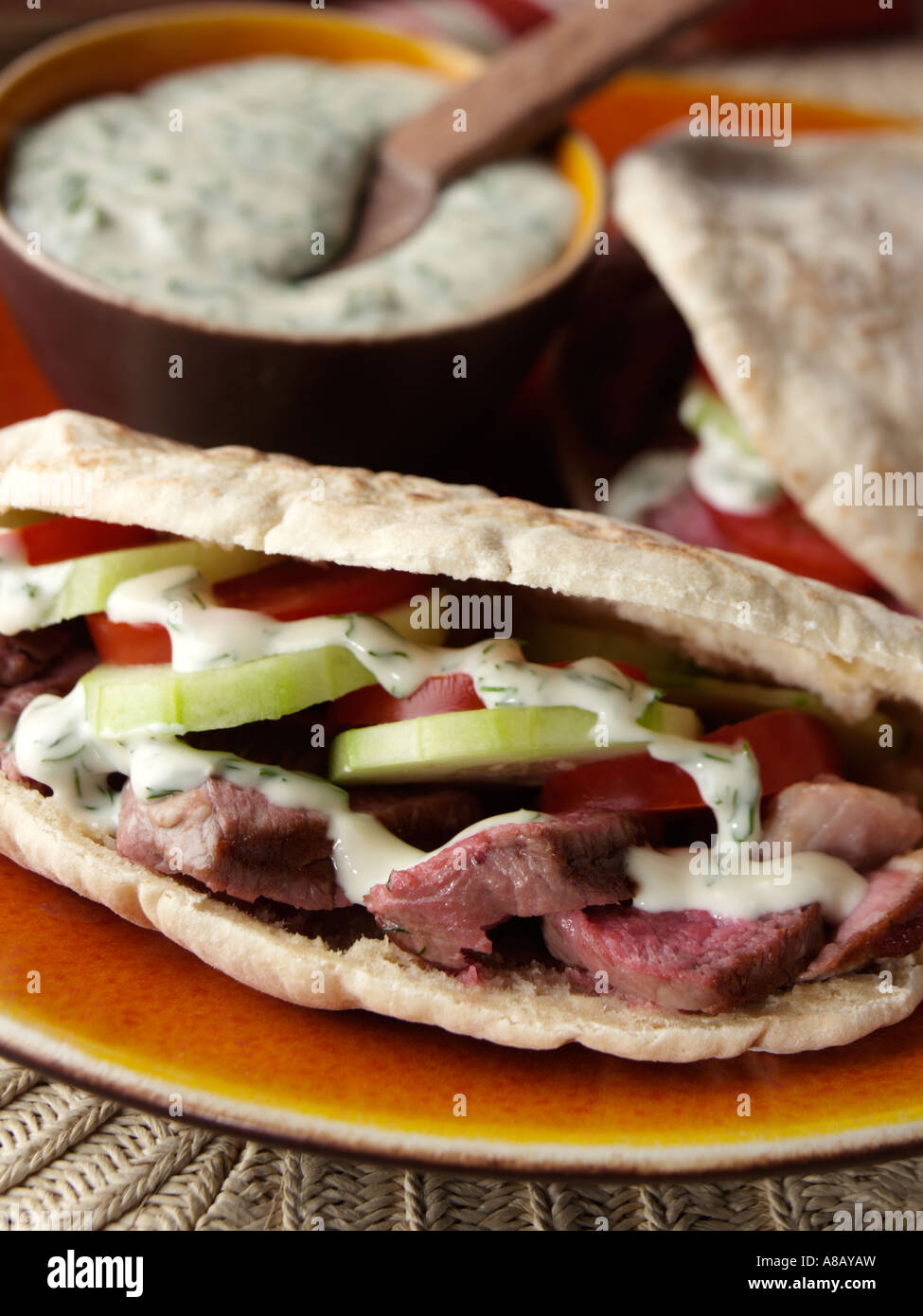 Grilled lamb in pitta bread with dill sauce editorial food Stock Photo ...