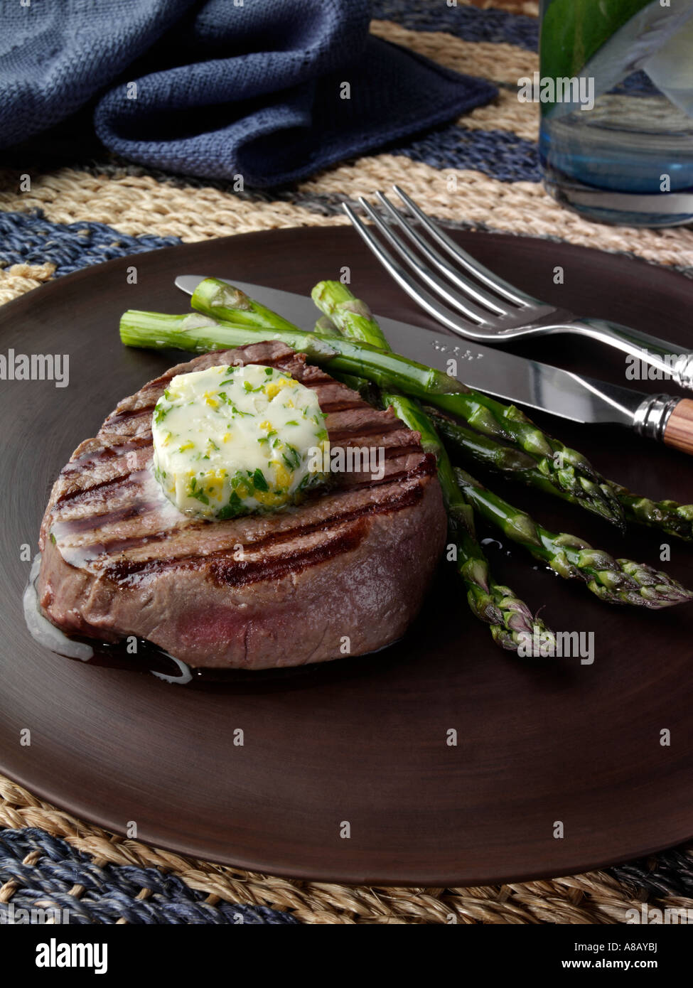 A plate of filet mignon steak and grilled asparagus editorial food ...