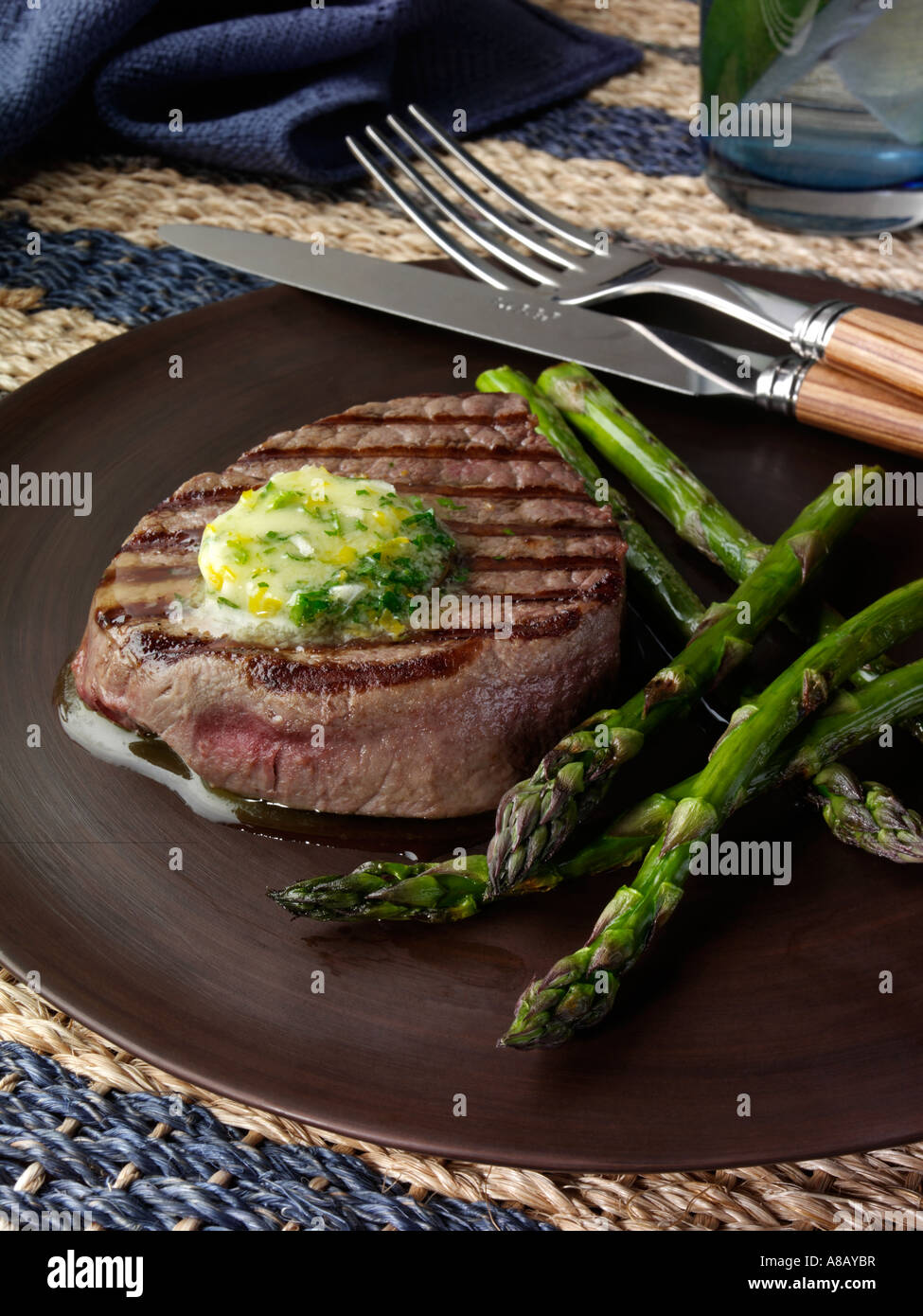 A plate of filet mignon steak and grilled asparagus editorial food ...