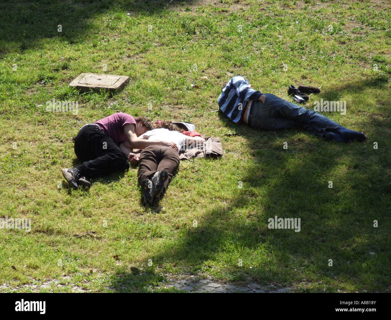 people sleeping in park in rome Stock Photo - Alamy