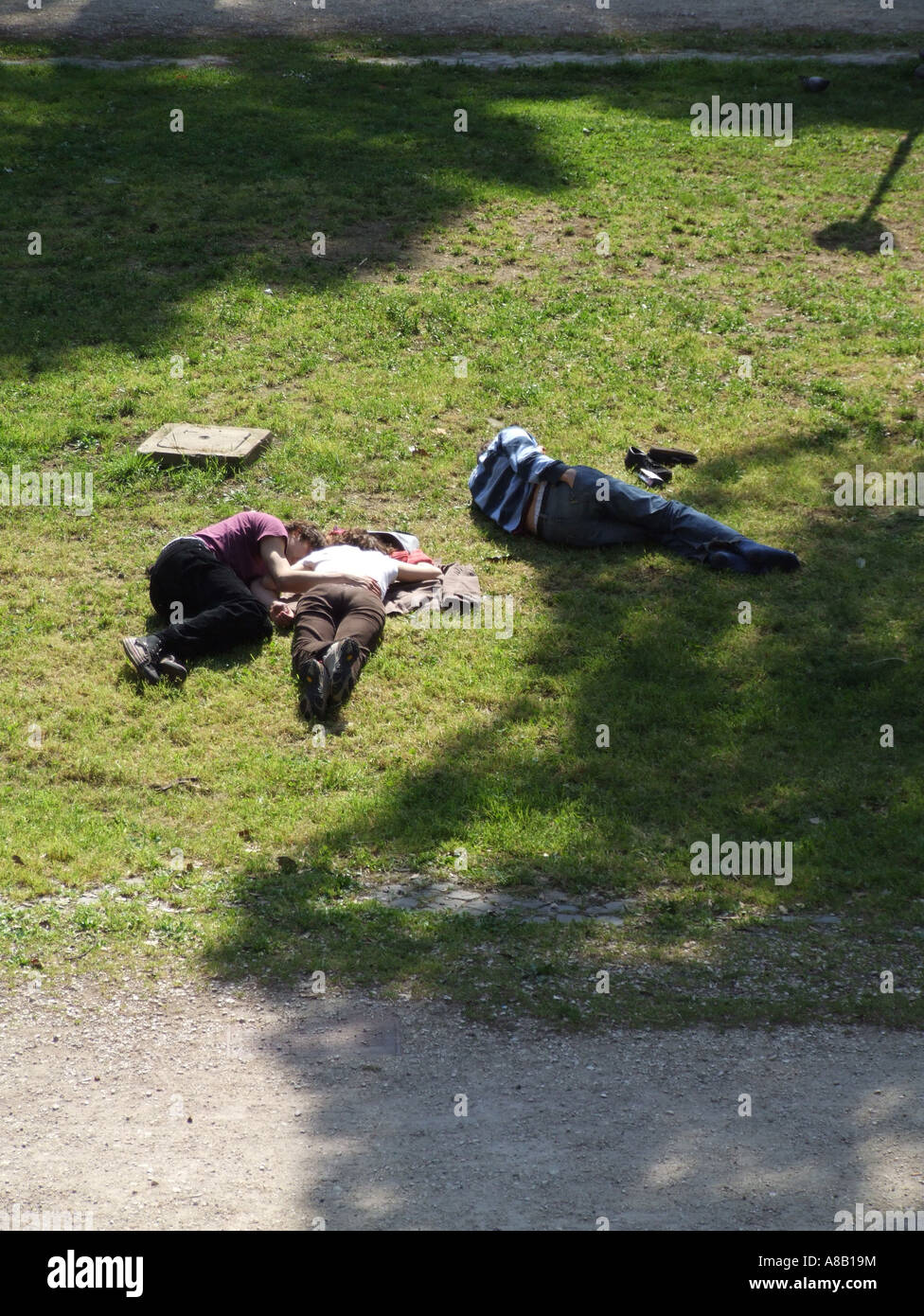 people sleeping in park in rome Stock Photo - Alamy
