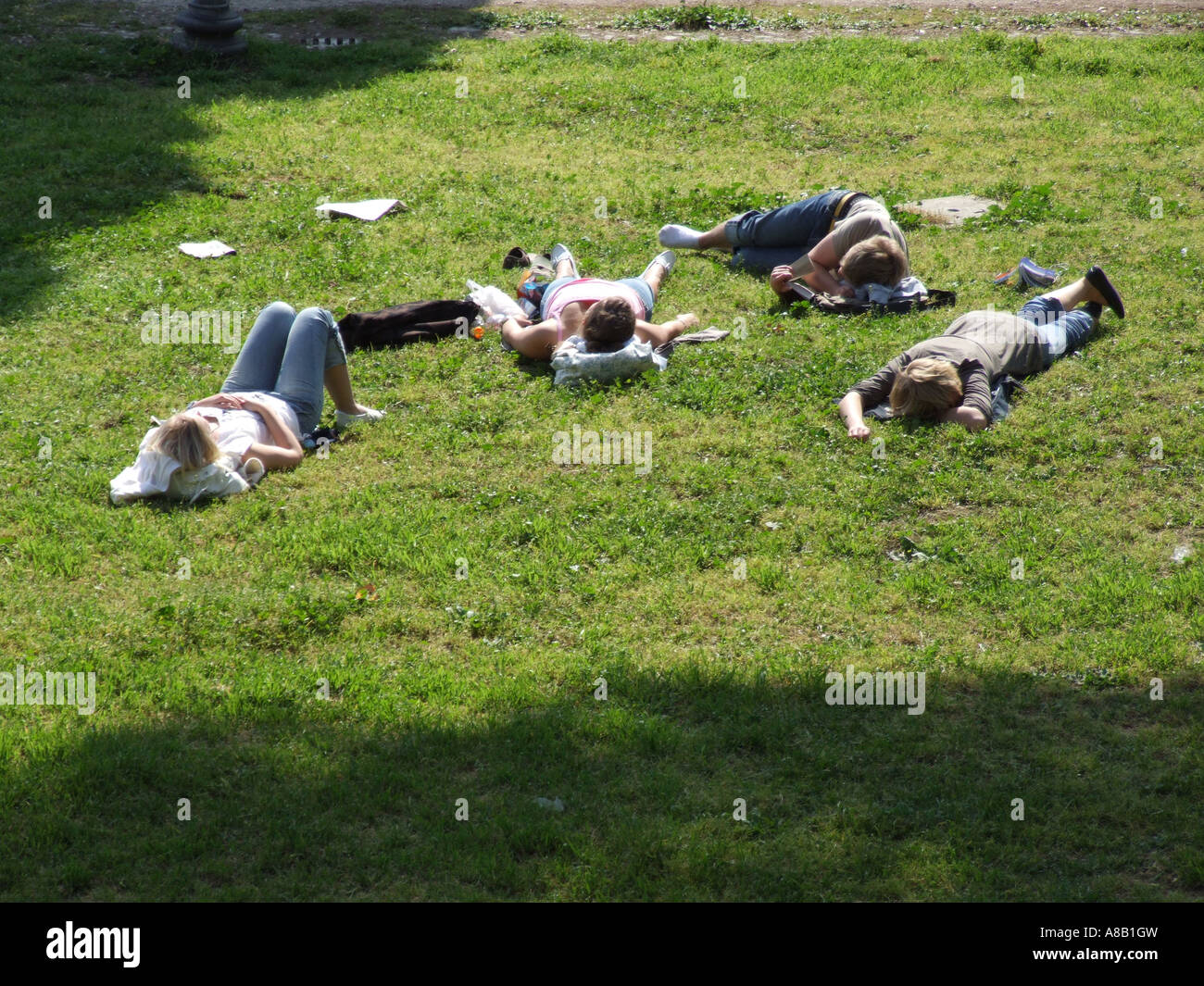 people sleeping in park in rome Stock Photo - Alamy